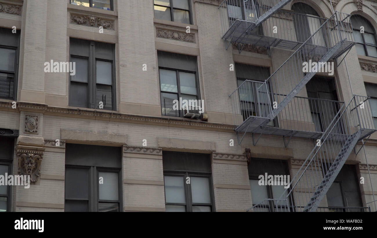 Daytime exterior establishing shot outside a typical generic urban city ...