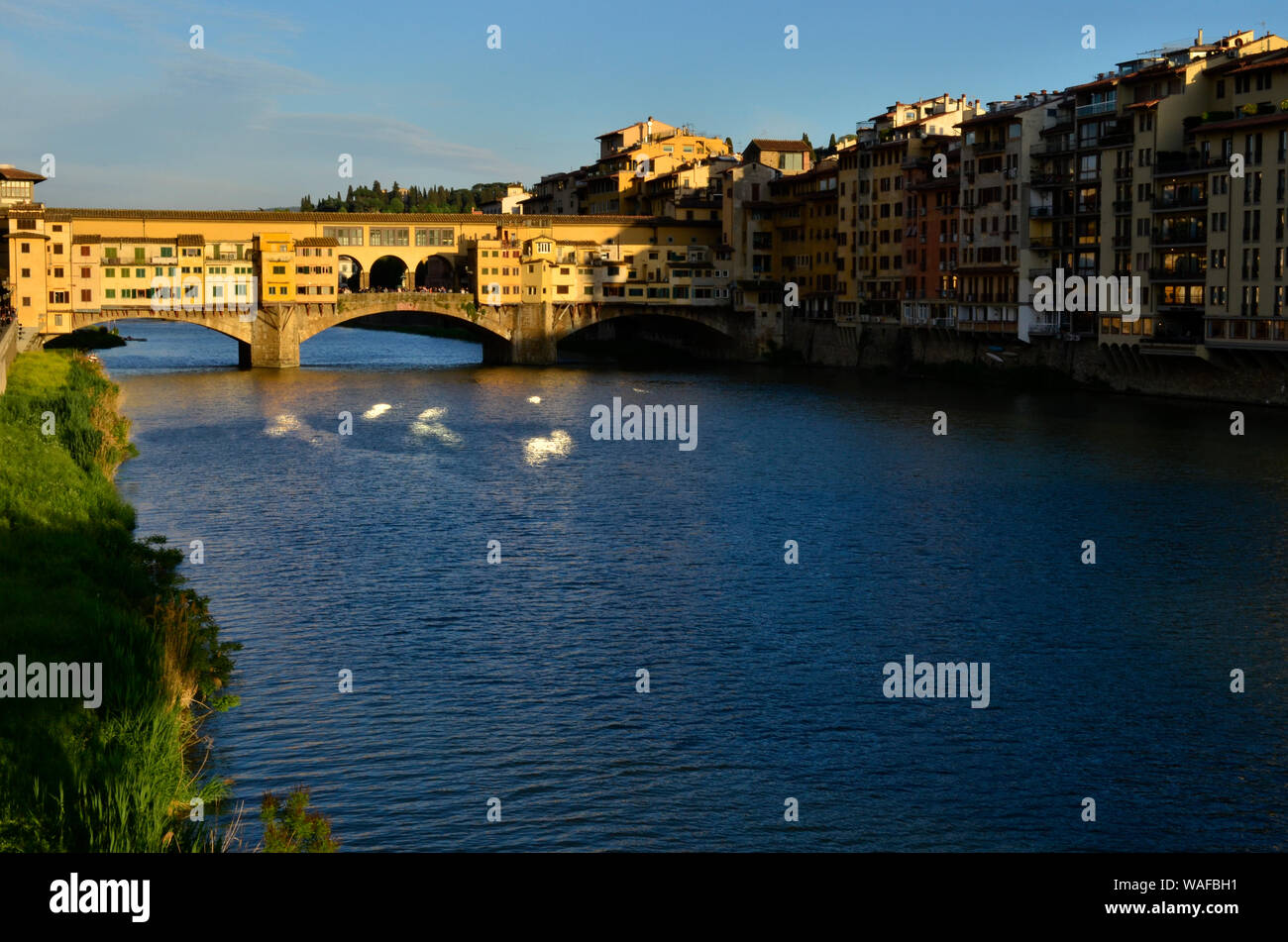 View of the famous Ponte Vecchio at sunset, in Florence, Italy Stock ...