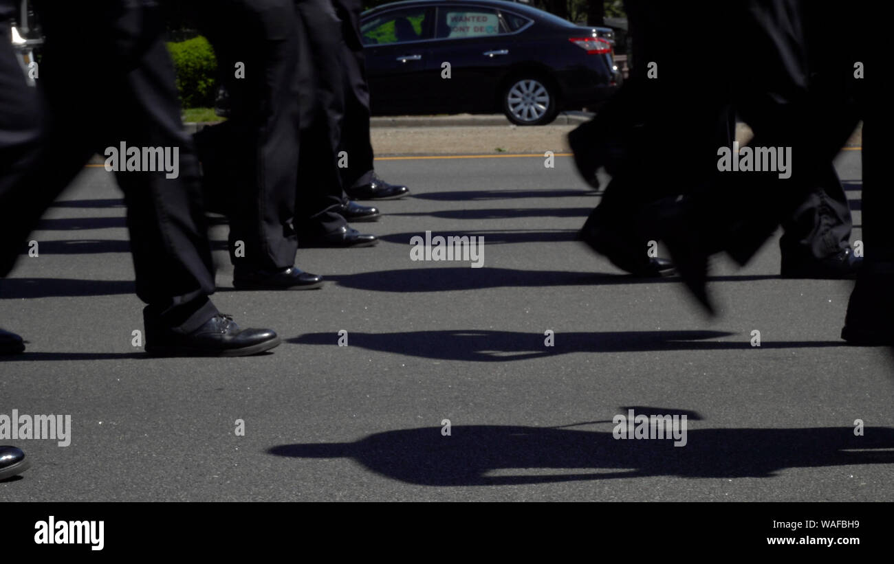 Parade motion still close up uniform service workers feet marching in ...