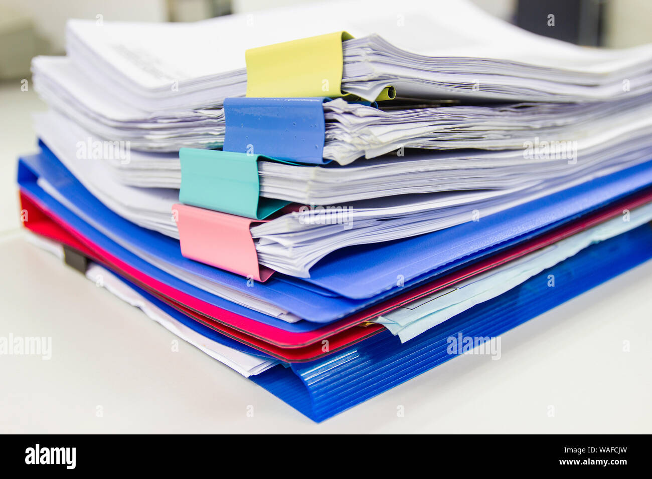 file folder and Stack of business report paper file on the table in a ...
