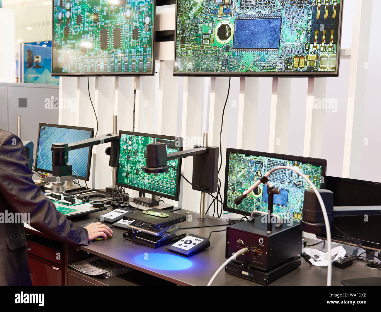 Digital microscopes with monitors from a quality control laboratory ...