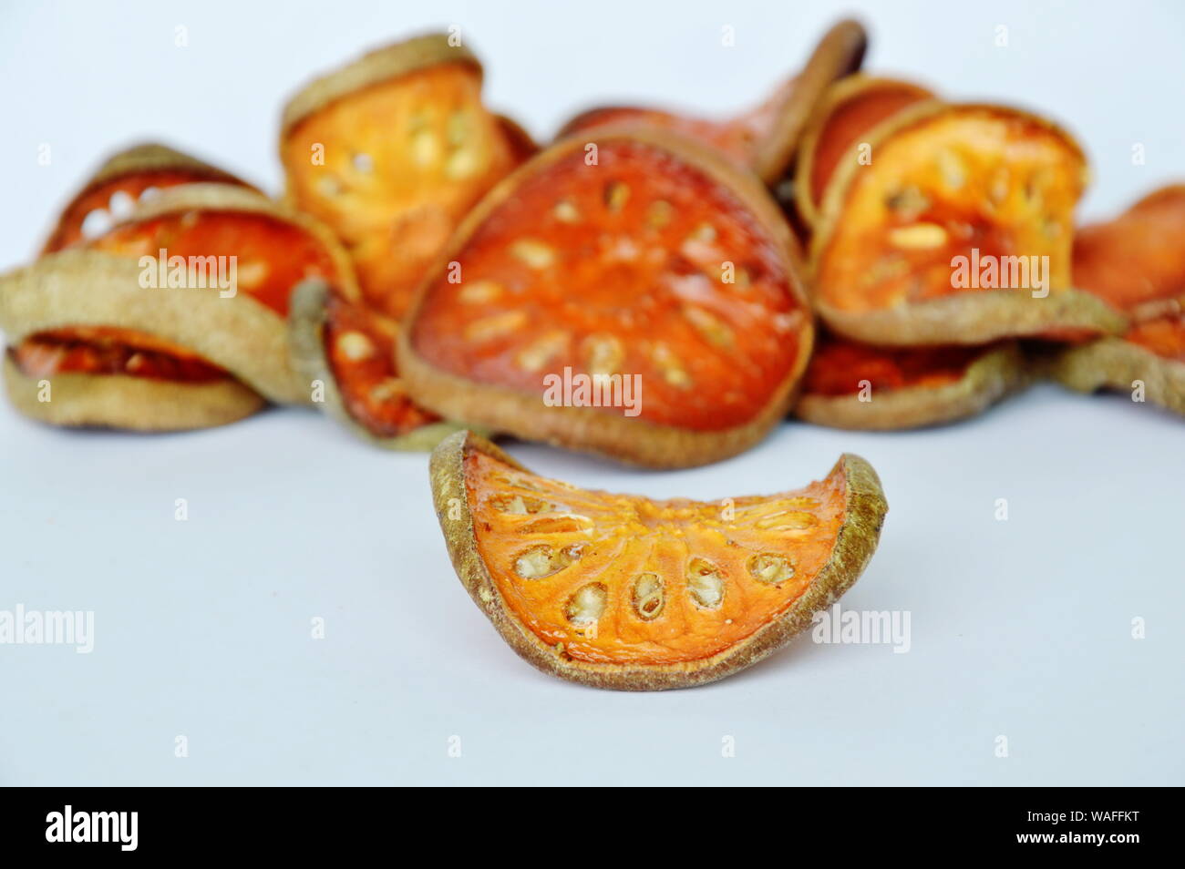 dried bael fruit on white background Stock Photo - Alamy