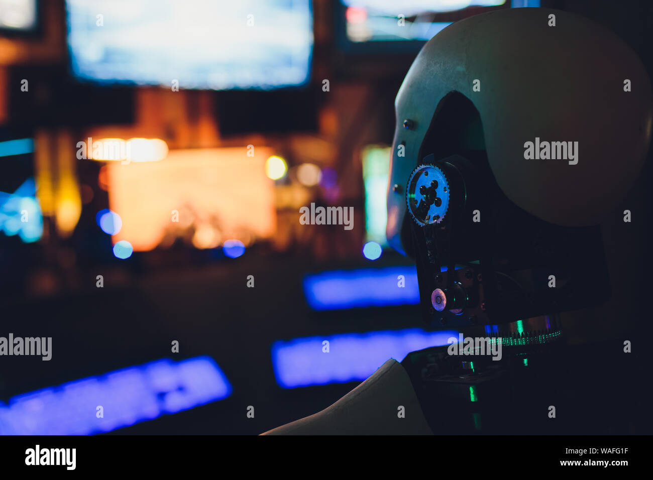 Close-up of humanoid robot head with micro-cameras eyes on blurred ...