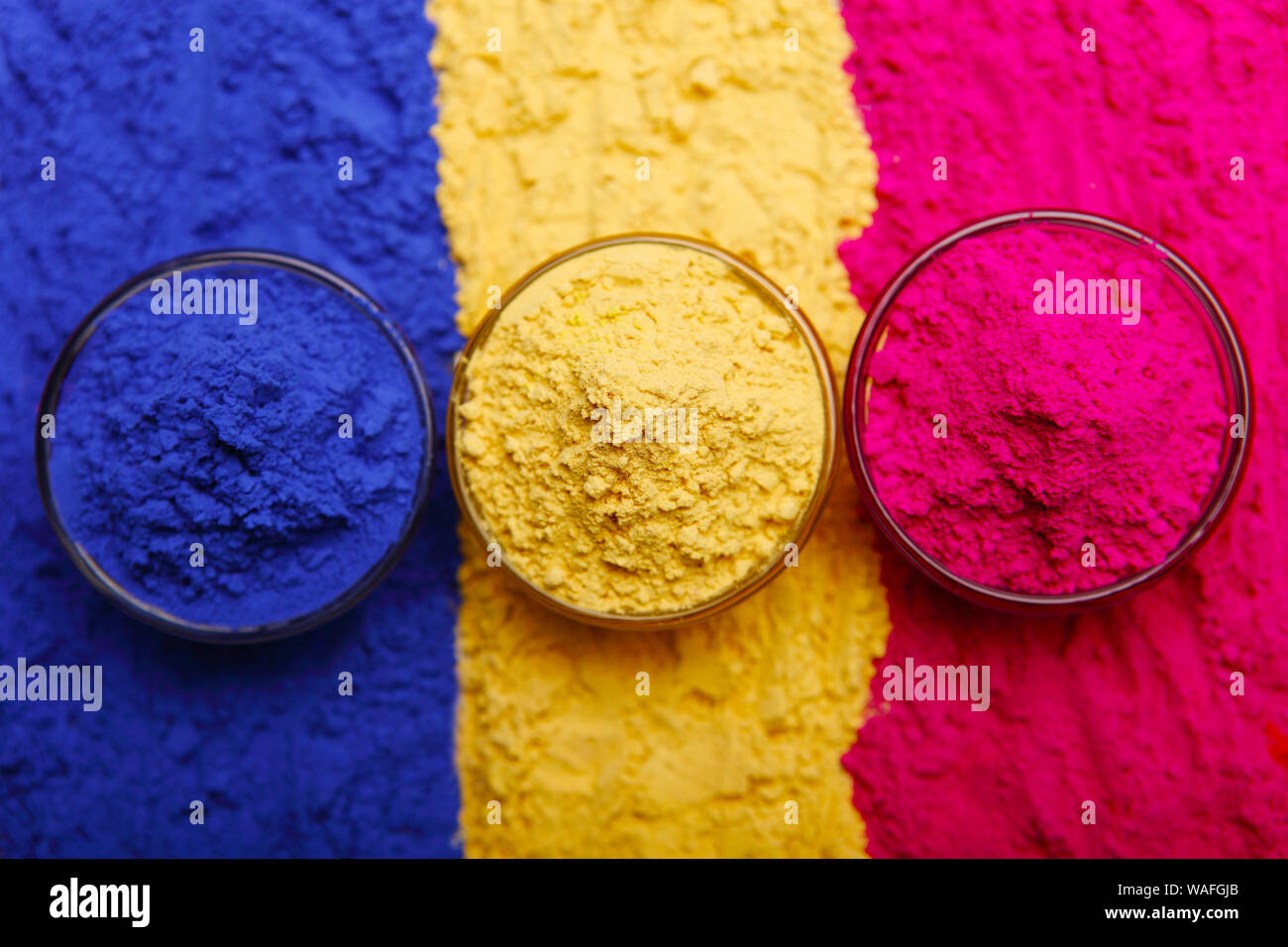 Bowls full of holi color in a row Stock Photo - Alamy