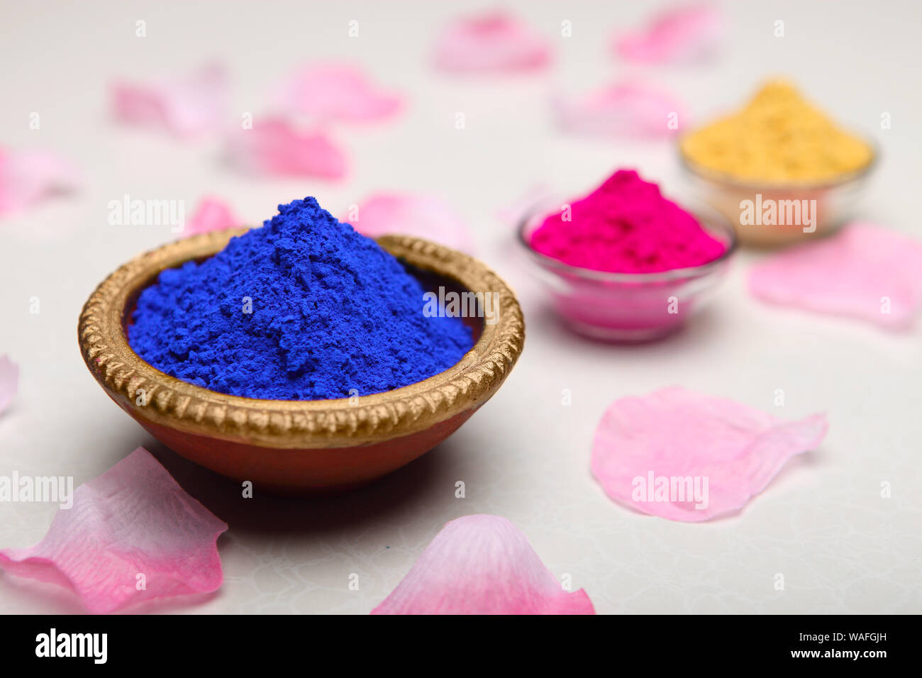 Bowls full of holi color in a row Stock Photo - Alamy