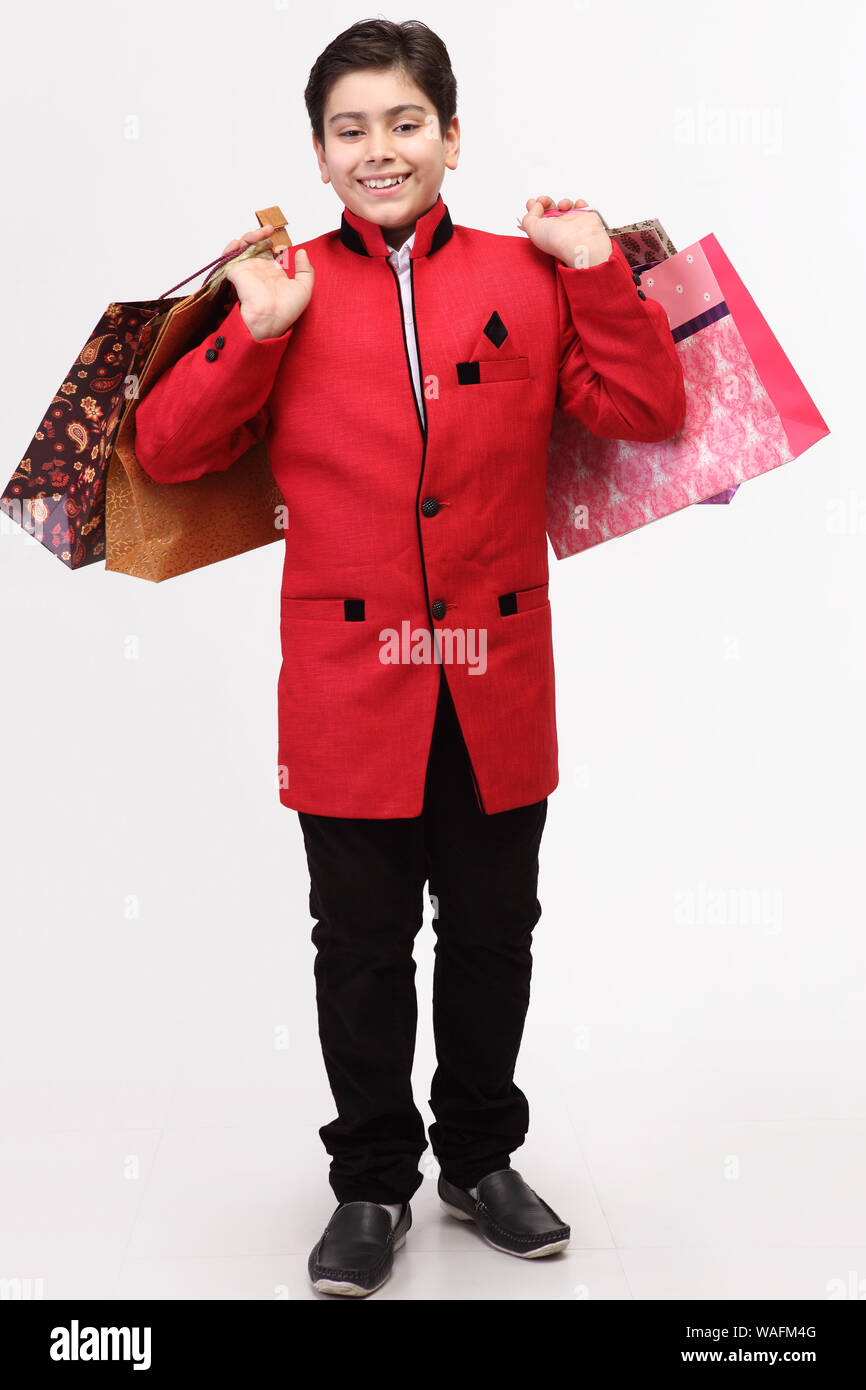 Boy carrying shopping bags Stock Photo - Alamy