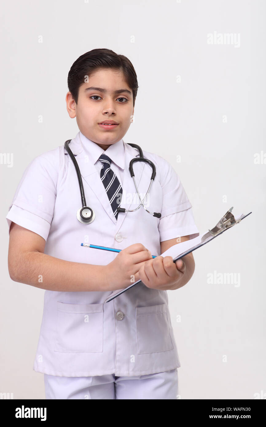 Boy pretending to be a doctor holding medical report Stock Photo - Alamy