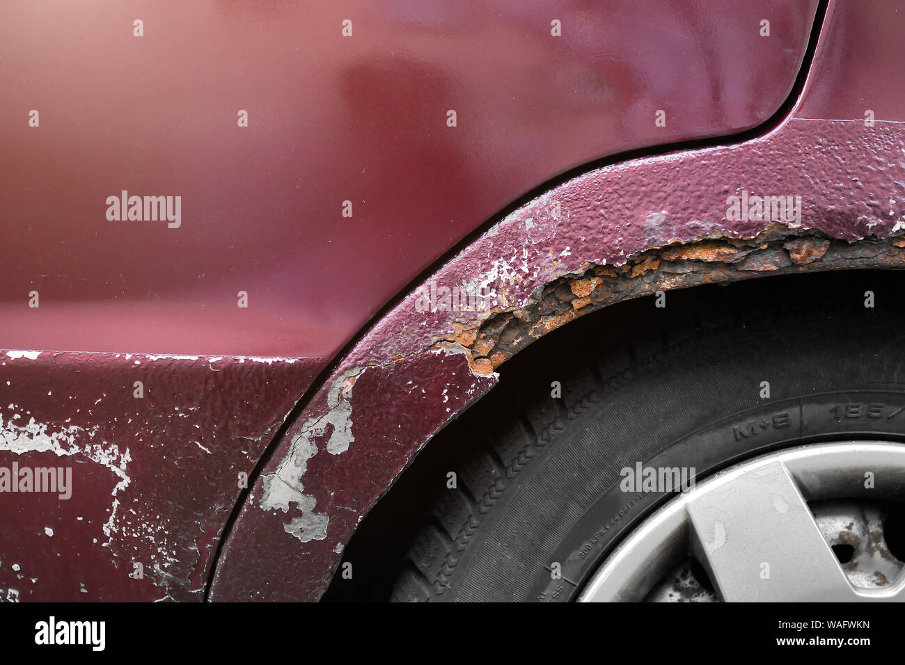 corrosion of the car body. Rusty wing close-up Stock Photo - Alamy