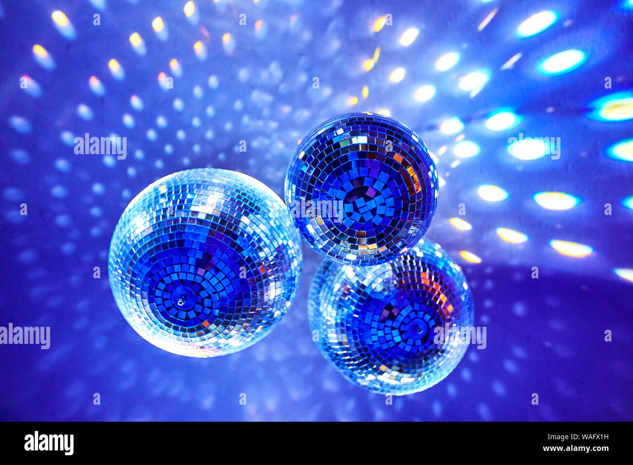 Disco balls with colorful bright rays , night party background photo ...