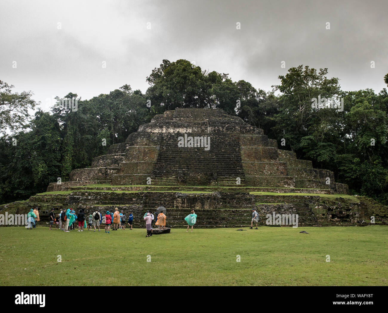 LAMANAI, BELIZE-JANUARY 15, 2018: Tourists observe and photograph the ...