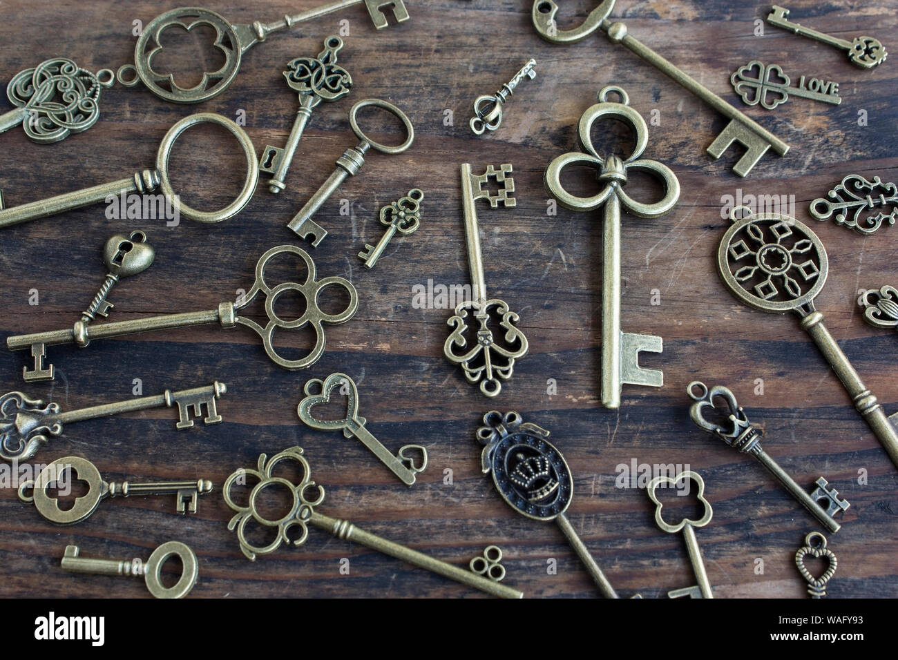 Vintage Keys on Rustic Wooden Background Stock Photo - Alamy