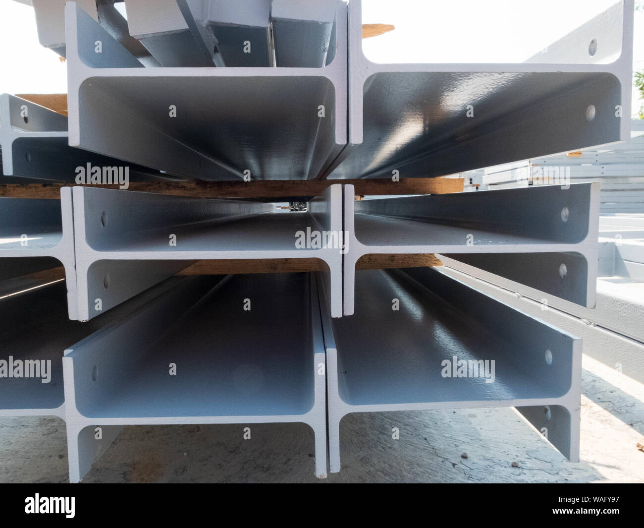 Stacked metal i-beams parts of a pre-fabricated building. Fast-built ...