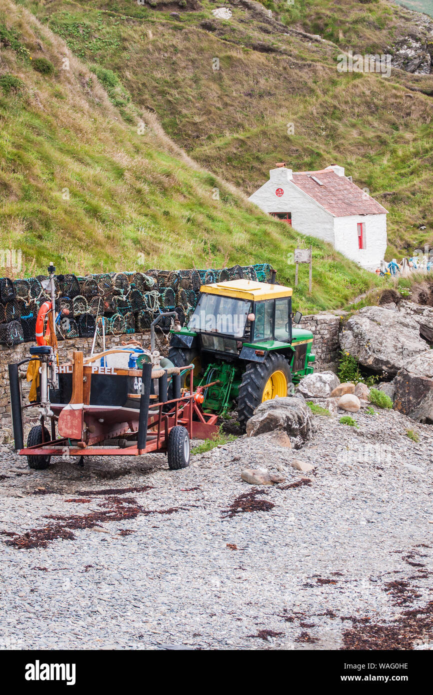 Fishing boat and tractor on the beach at Niarbyl, Isle of Man Stock ...