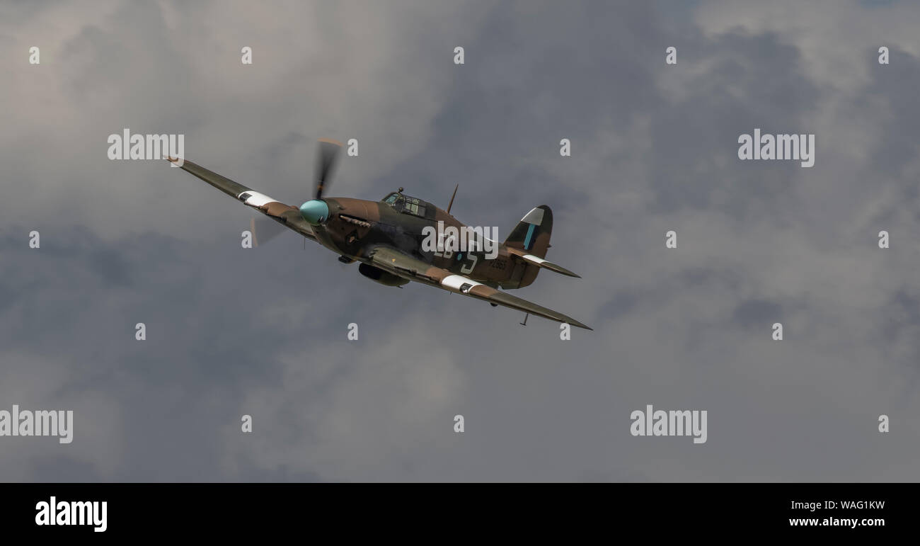 Spitfire in flight in the sky with copy space Stock Photo - Alamy