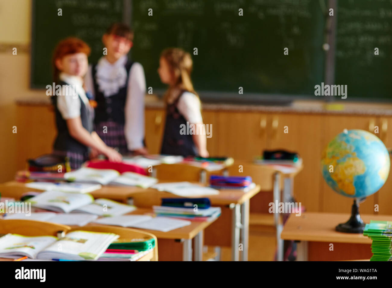 Primary school students talk during the break in class Stock Photo - Alamy