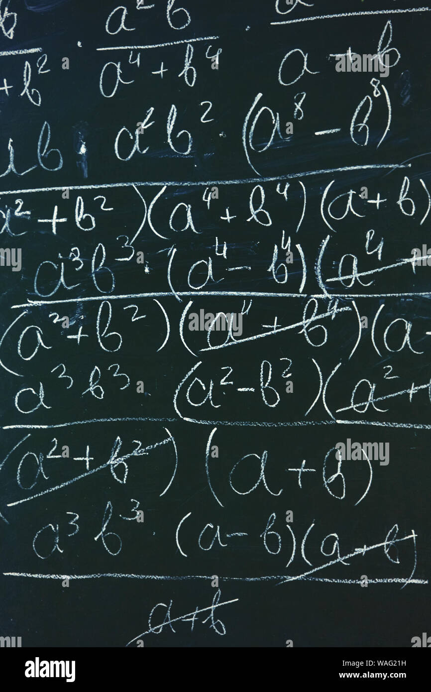 Maths formulas written by white chalk on the chalkboard background ...