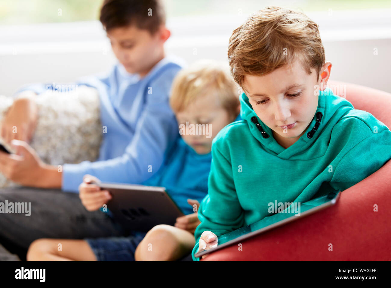 Children playing on tablet Stock Photo - Alamy