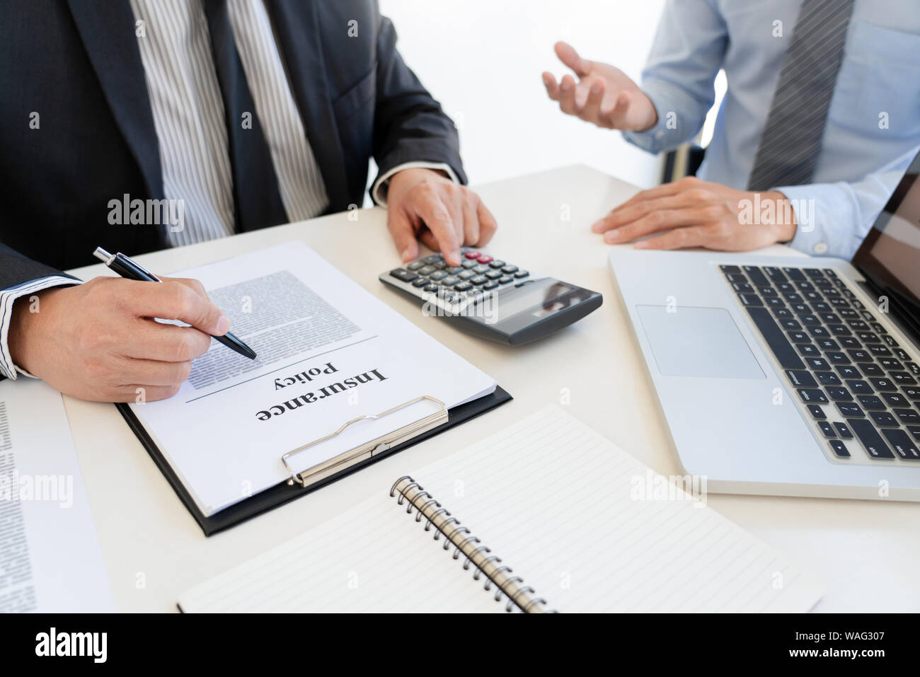 Confident insurance agent broker man holding document and present ...