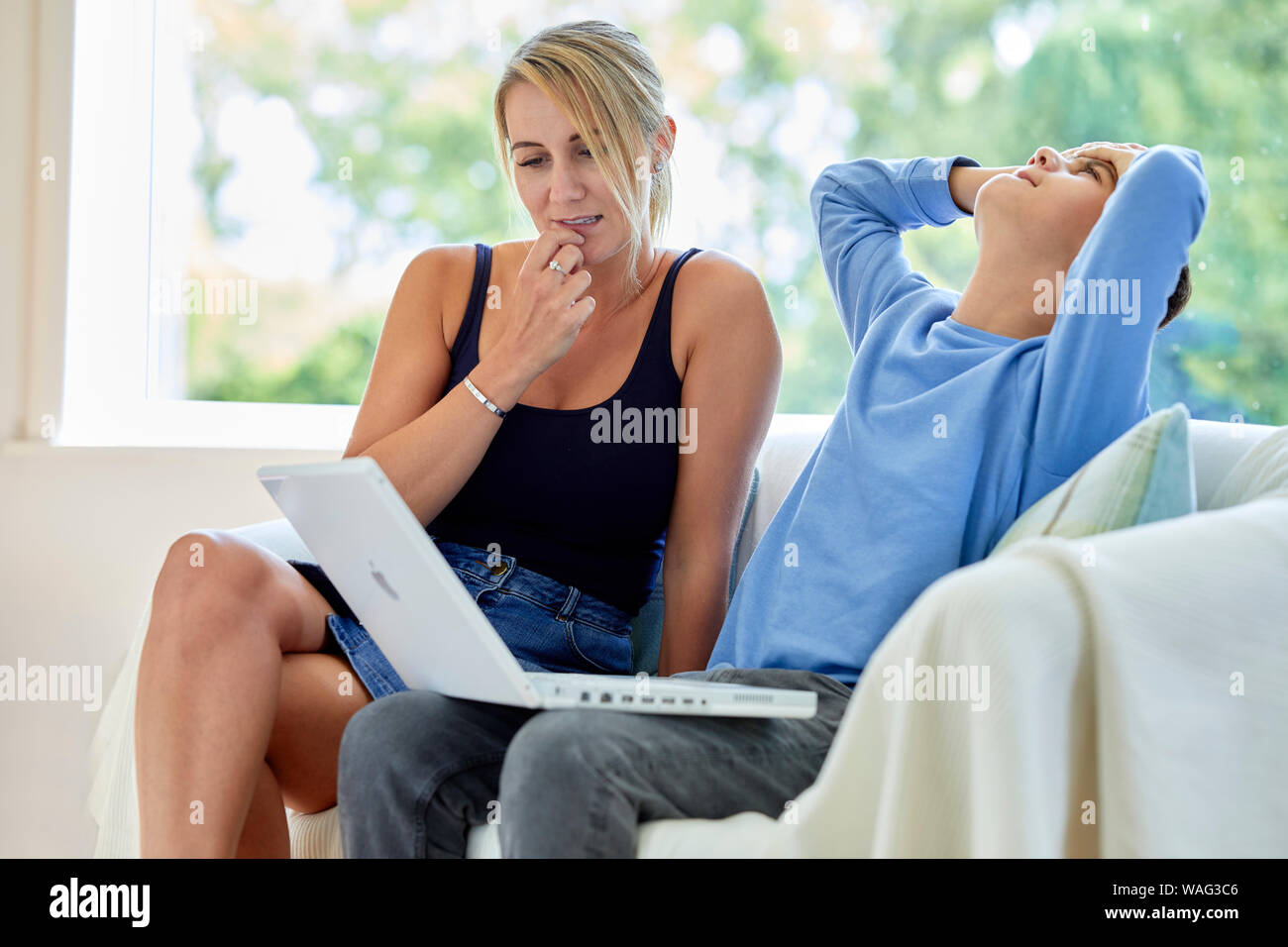 Mother helping her son with homework Stock Photo - Alamy