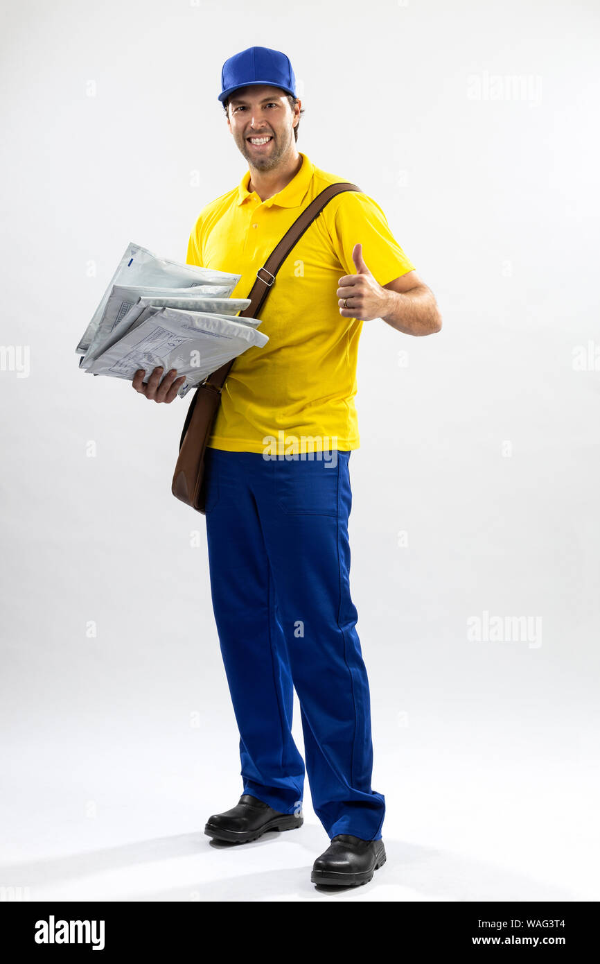 Brazilian mailman on a white background delivering a package. copy ...