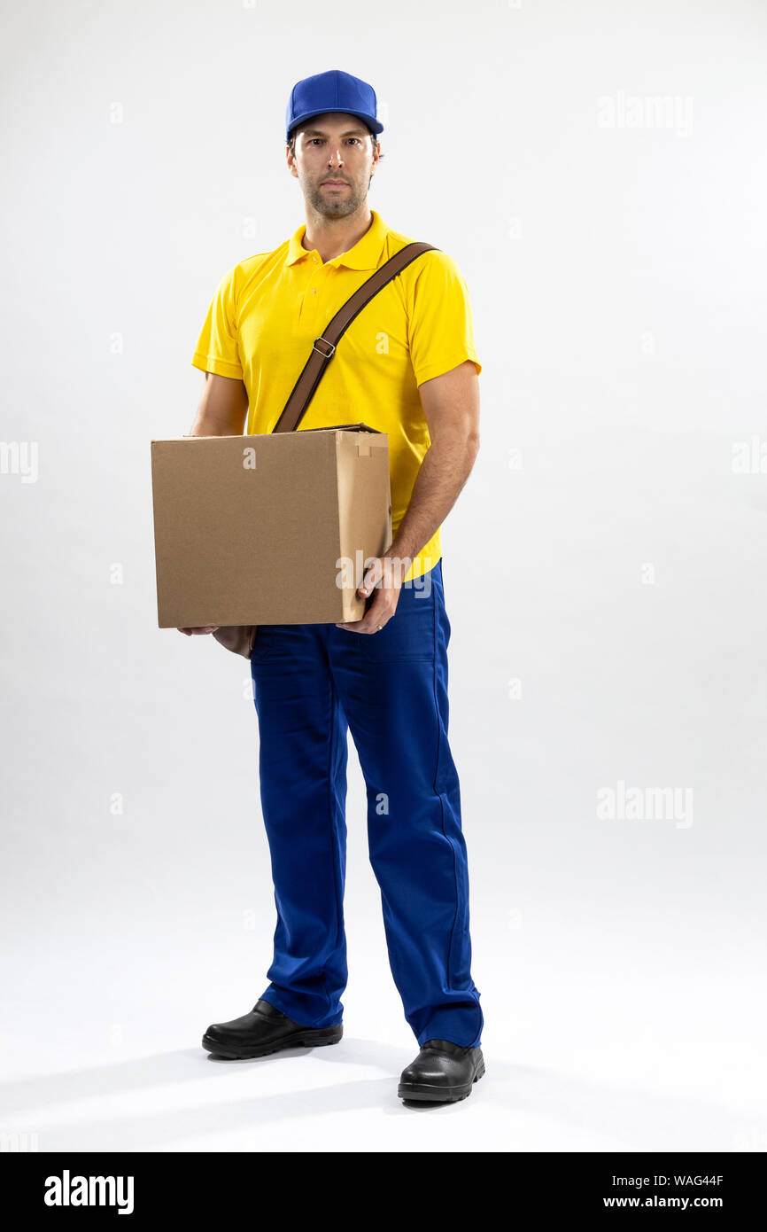 Brazilian mailman on a white background delivering a package. copy ...
