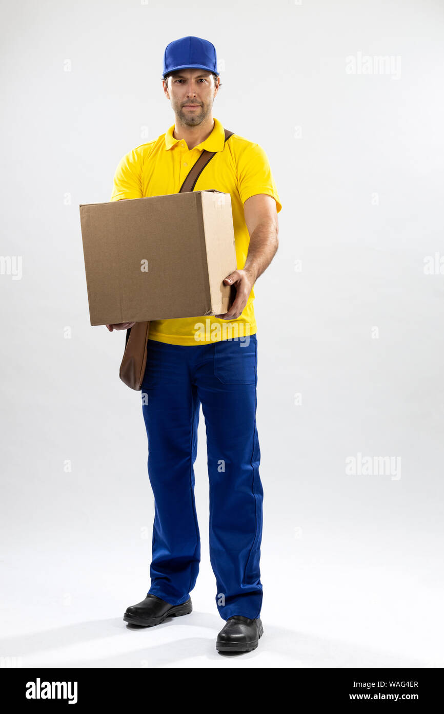 Brazilian mailman on a white background delivering a package. copy ...