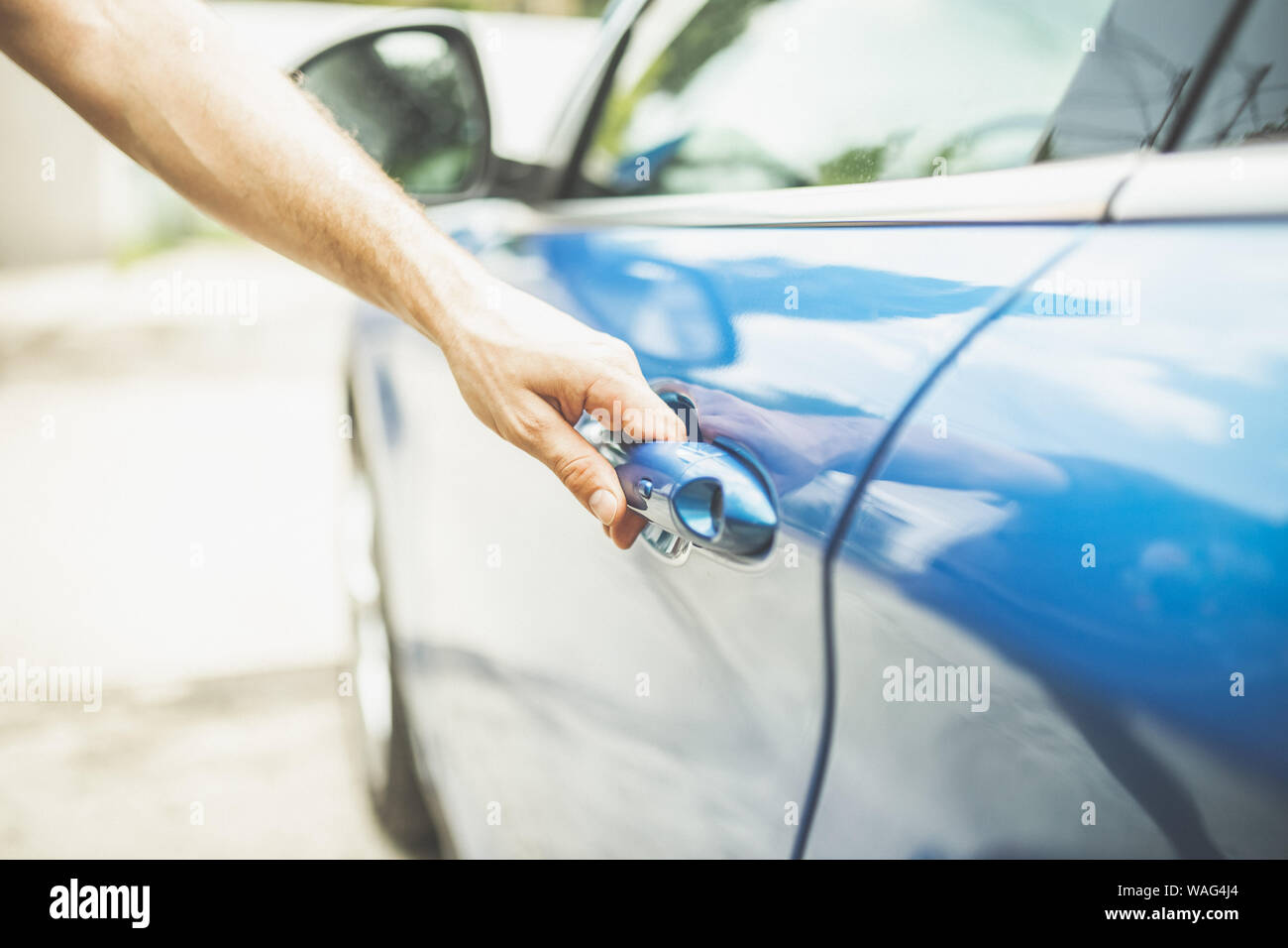 Hand on handle. Close-up of man hand opening a car door Stock Photo - Alamy