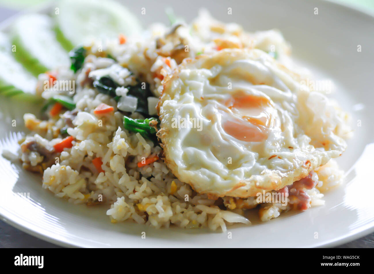 fried rice or stir-fried rice with fried egg and cucumber Stock Photo ...