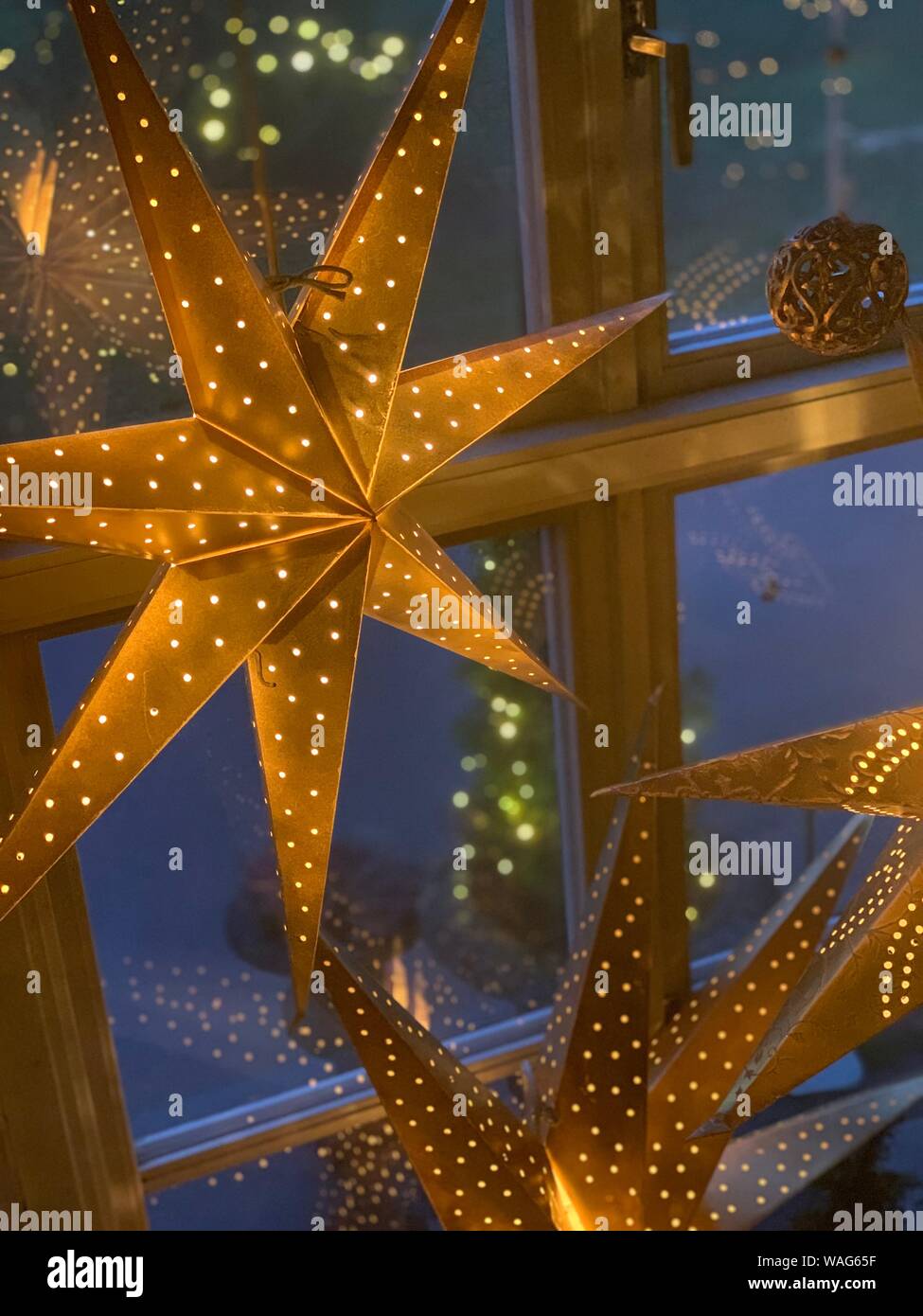 Christmas star hanging in window Stock Photo - Alamy