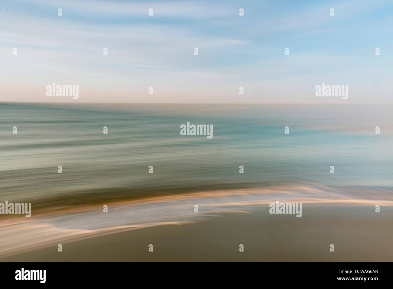 Abstract View of Ocean Waves on Beach at Sunset Stock Photo - Alamy