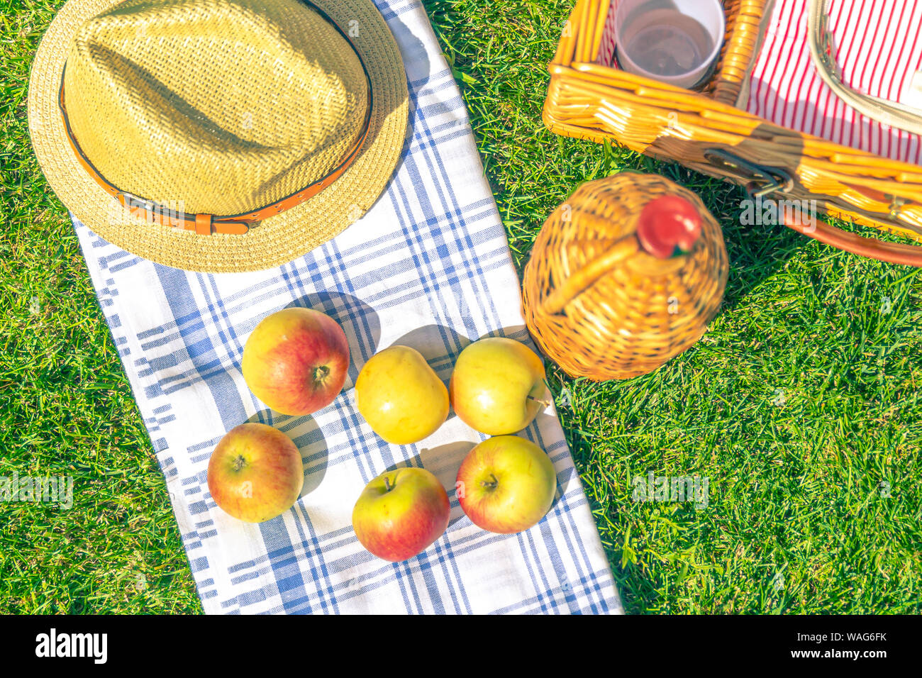 Flat lay view of Picnic basket with food on green sunny lawn Stock ...