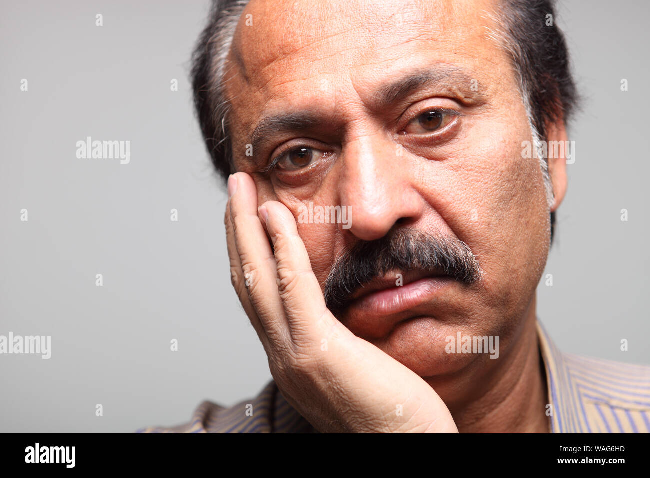 Old man looking sad Stock Photo - Alamy