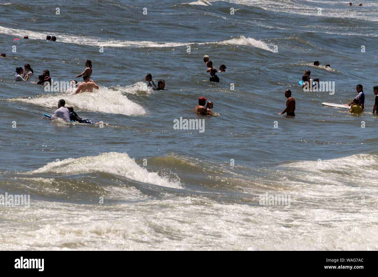 Swimmers enjoying the surf at Mooloolaba Beach on the Sunshine Coast in ...