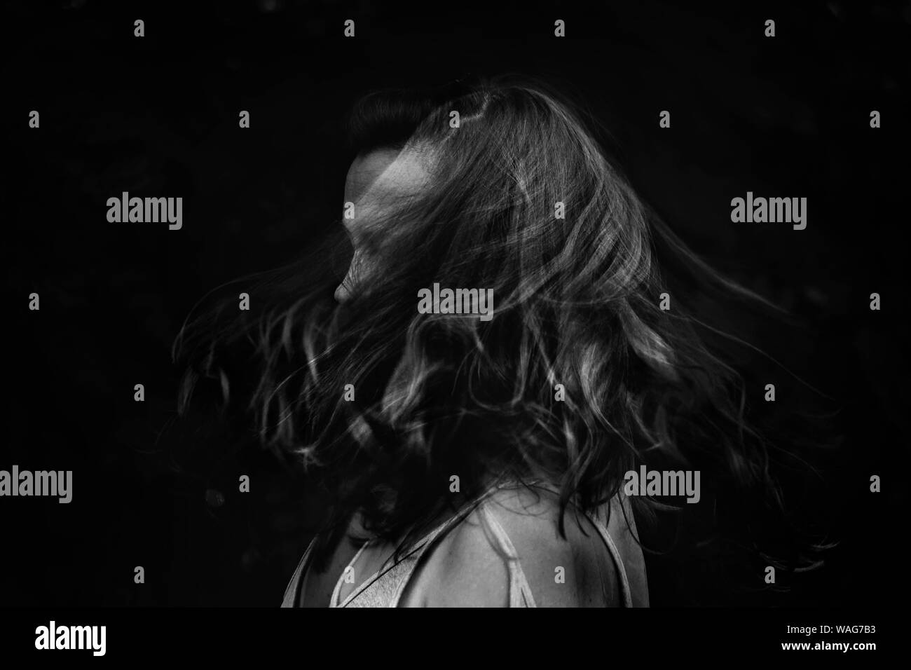 Black and white portrait of a female swishing hair Stock Photo - Alamy