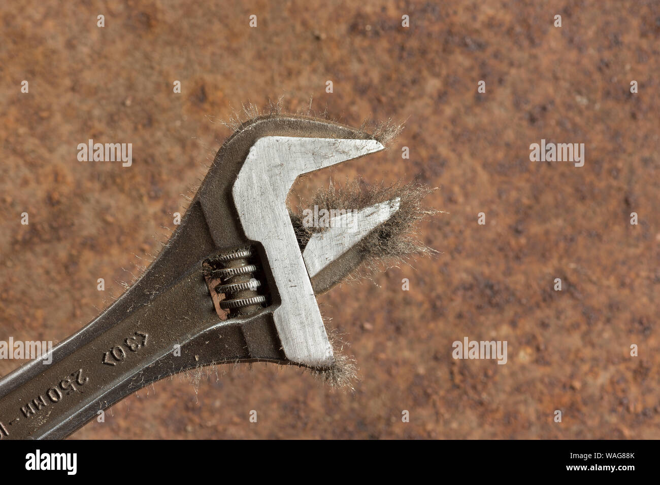 Wide jaw adjustable iron tempered metal spanner, wrench, covered in ...