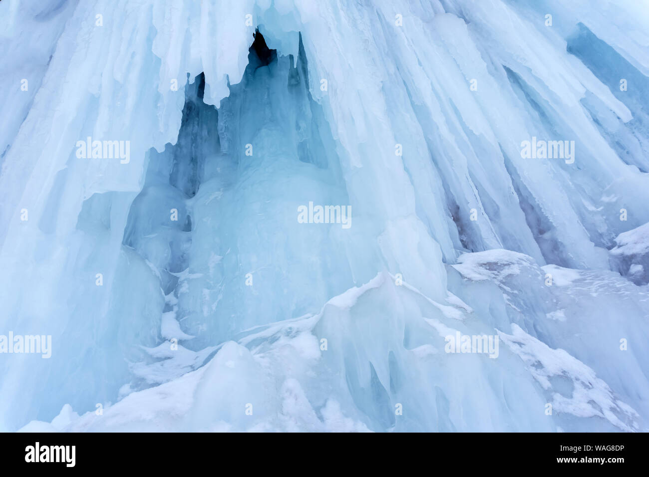 background - natural ice, section of glacier with icicles, frozen ...