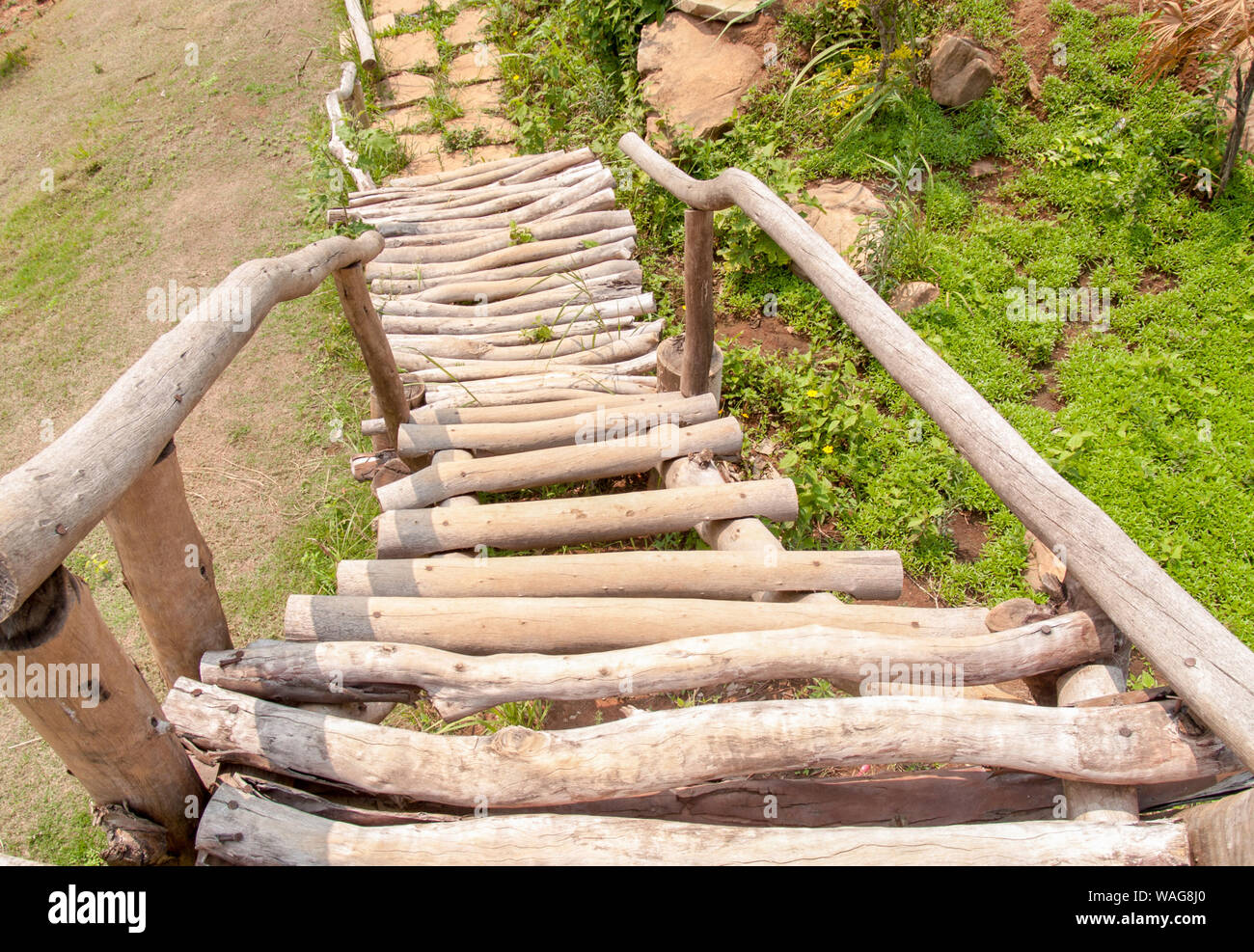 Staircase made of wood that is outdoors, Showing a path down to the ...