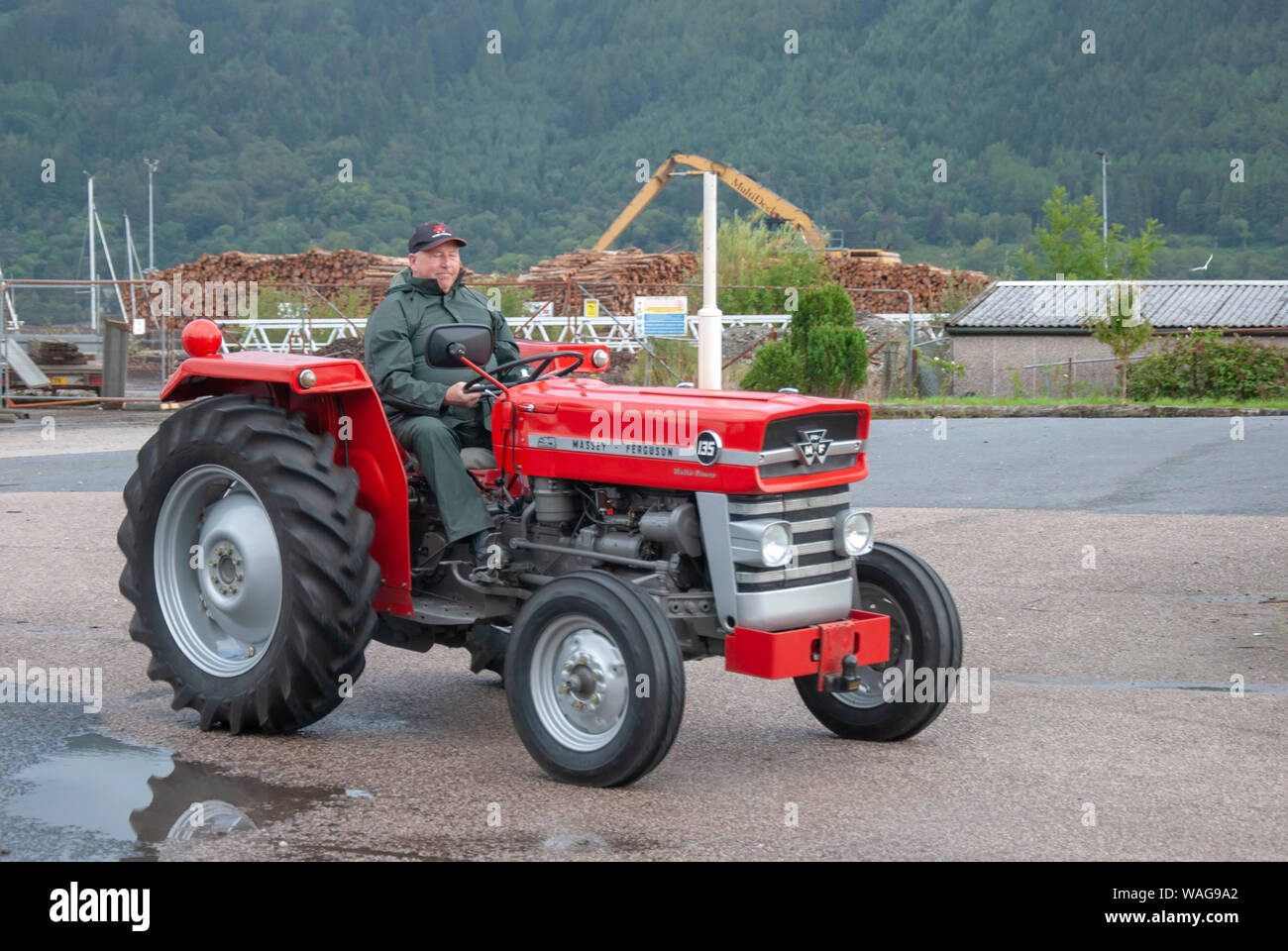 Man Driving Red Grey 1965 Massey Ferguson 135 Multi Power Tractor male ...