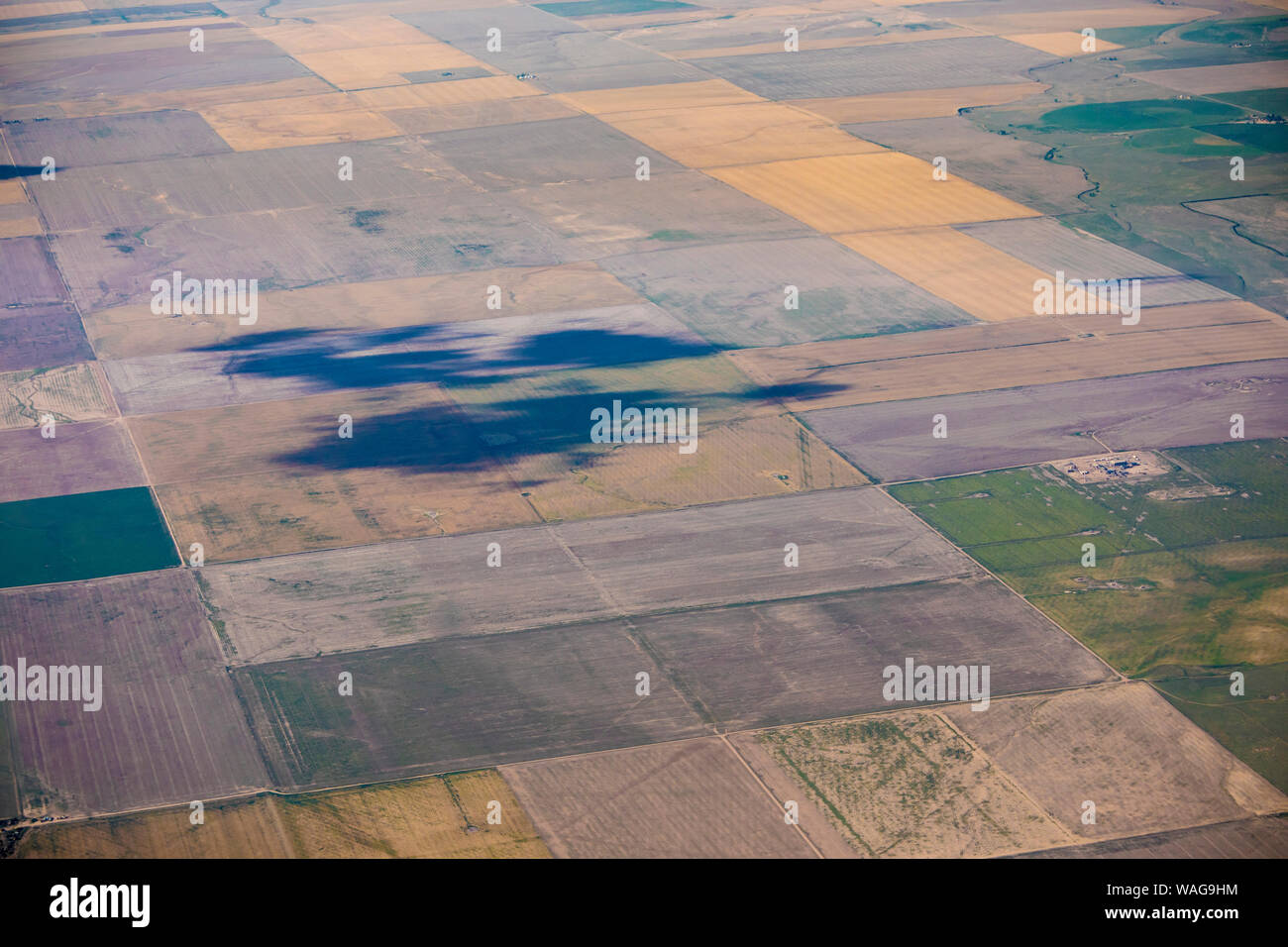 Aerial view of patchwork of farm fields along the Kansas, Colorado ...