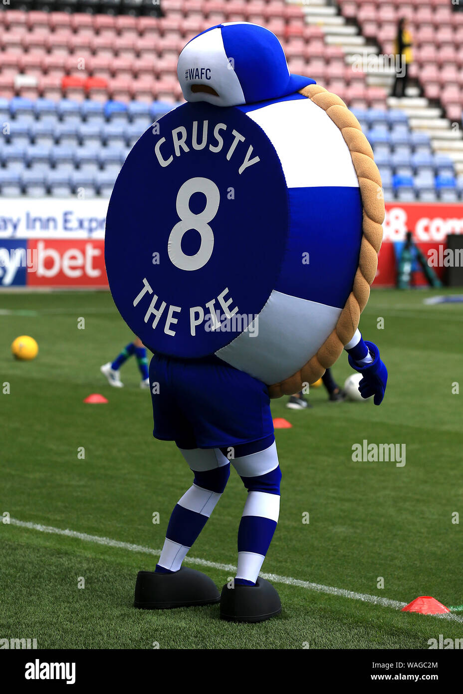 Wigan Athletic mascot Crusty The Pie entertaining fans before the game ...