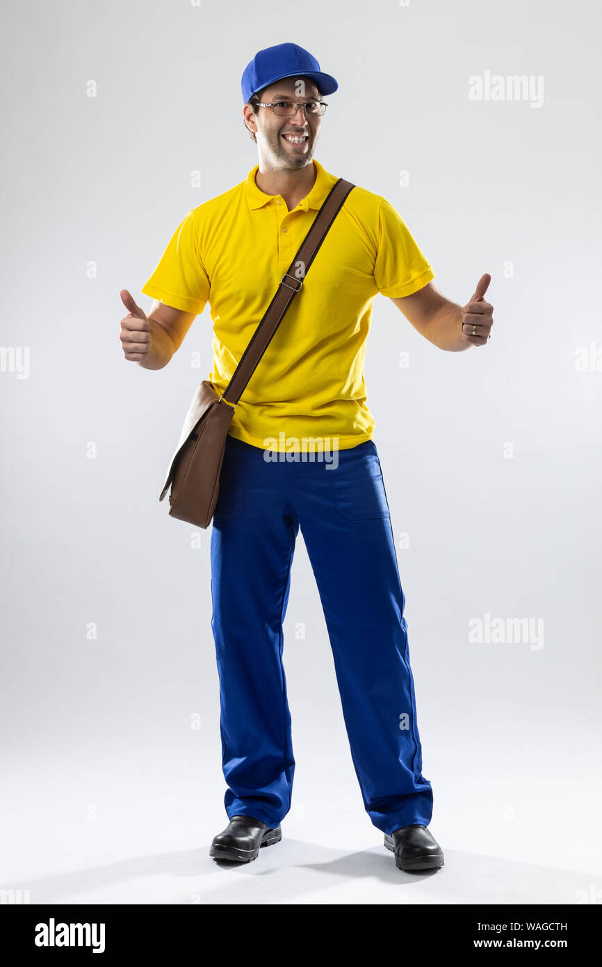 Brazilian mailman on a white background delivering a package. copy ...