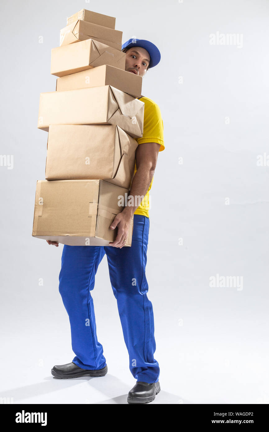 Brazilian mailman on a white background delivering a package. copy ...