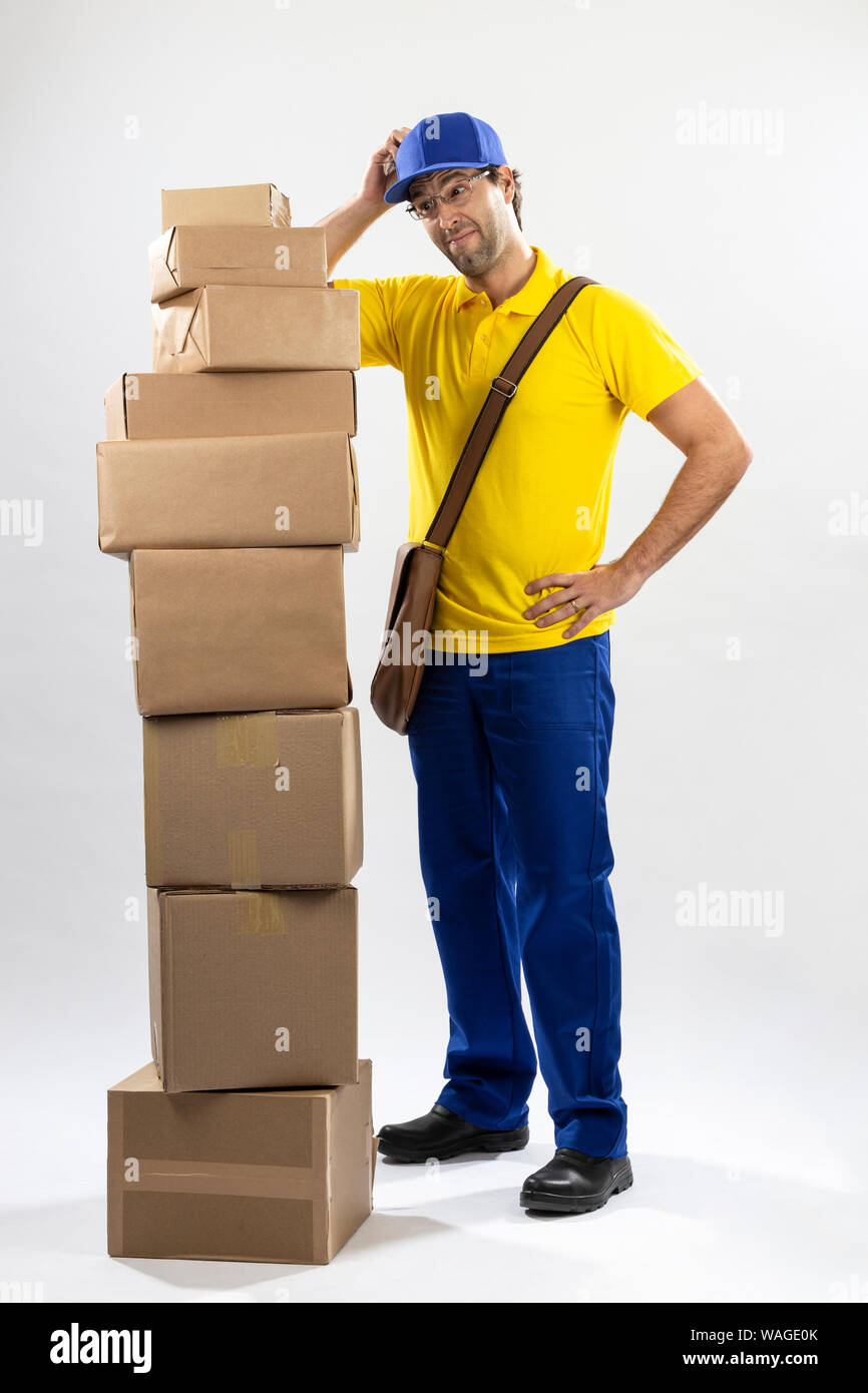 Brazilian mailman on a white background delivering a package. copy ...