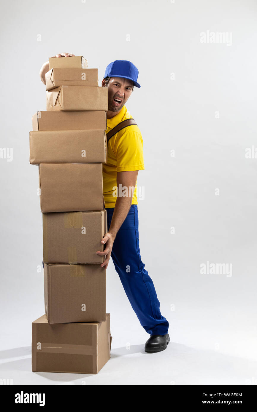 Brazilian mailman on a white background delivering a package. copy ...