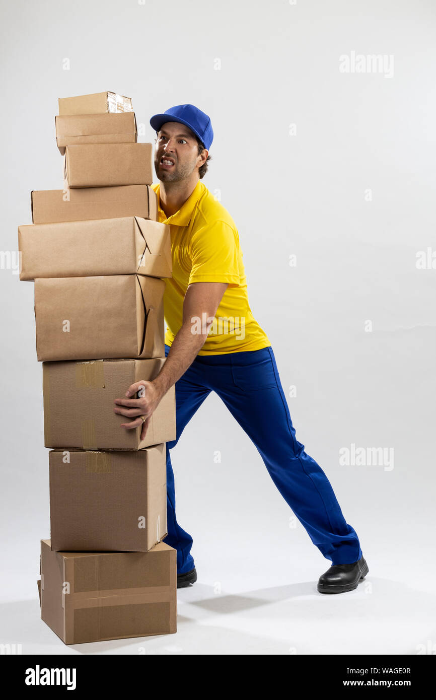 Brazilian mailman on a white background delivering a package. copy ...