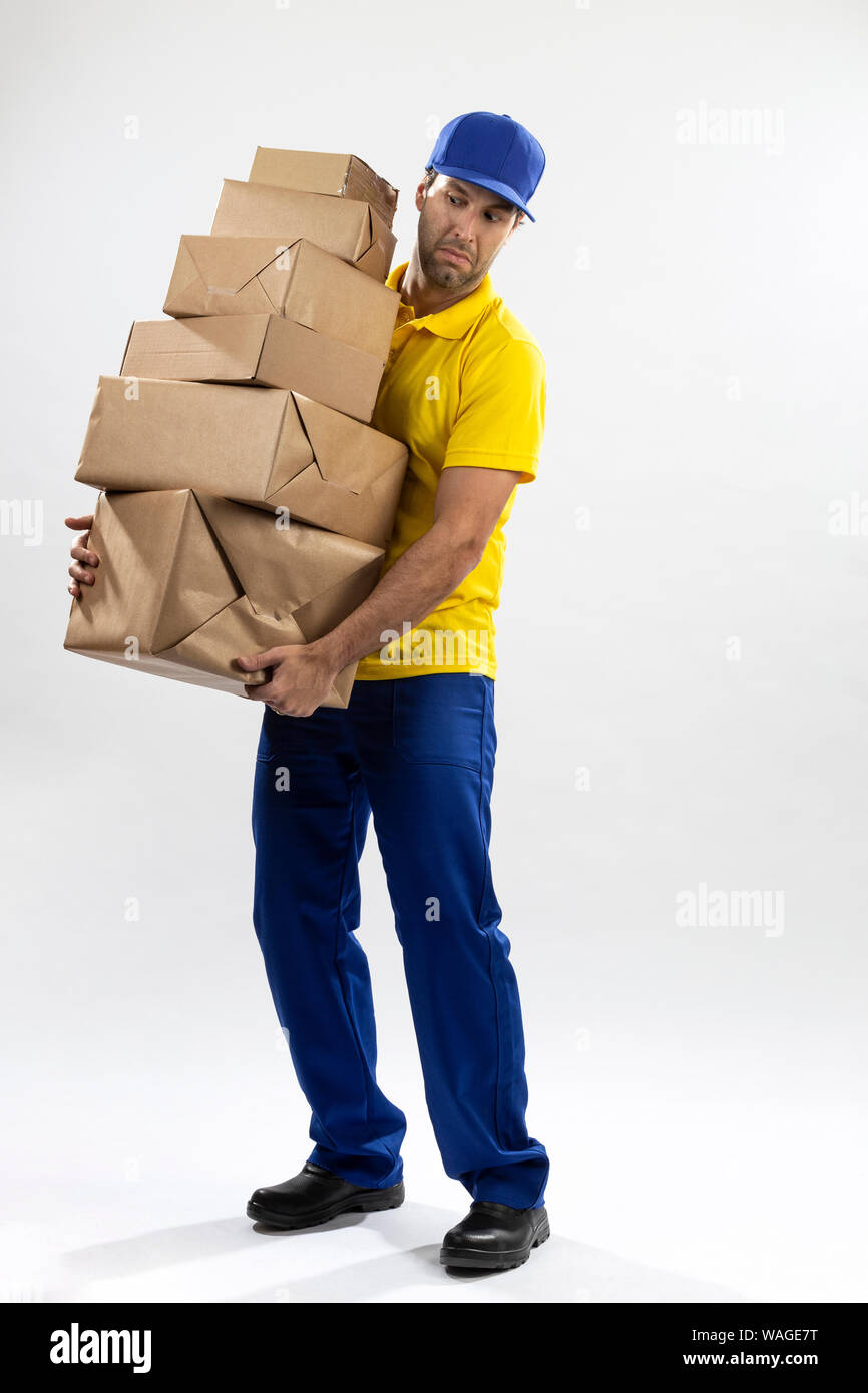 Brazilian mailman on a white background delivering a package. copy ...