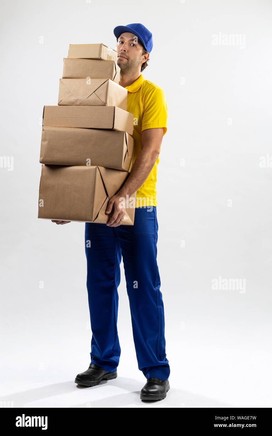 Brazilian mailman on a white background delivering a package. copy ...