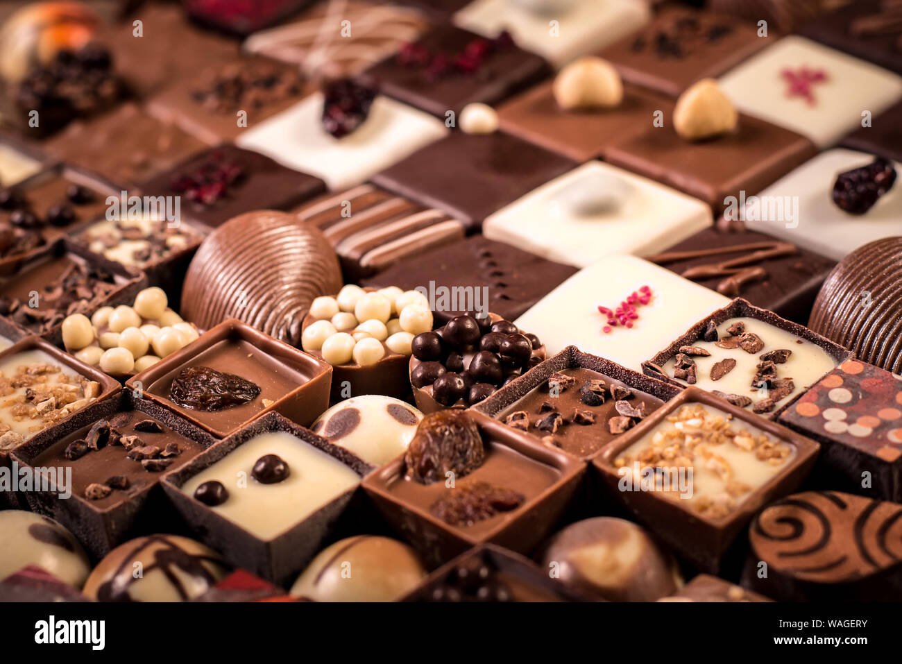 Assortment of fine chocolate candies, white, dark and milk chocolate ...