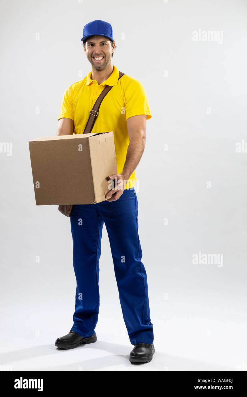 Brazilian mailman on a white background delivering a package. copy ...