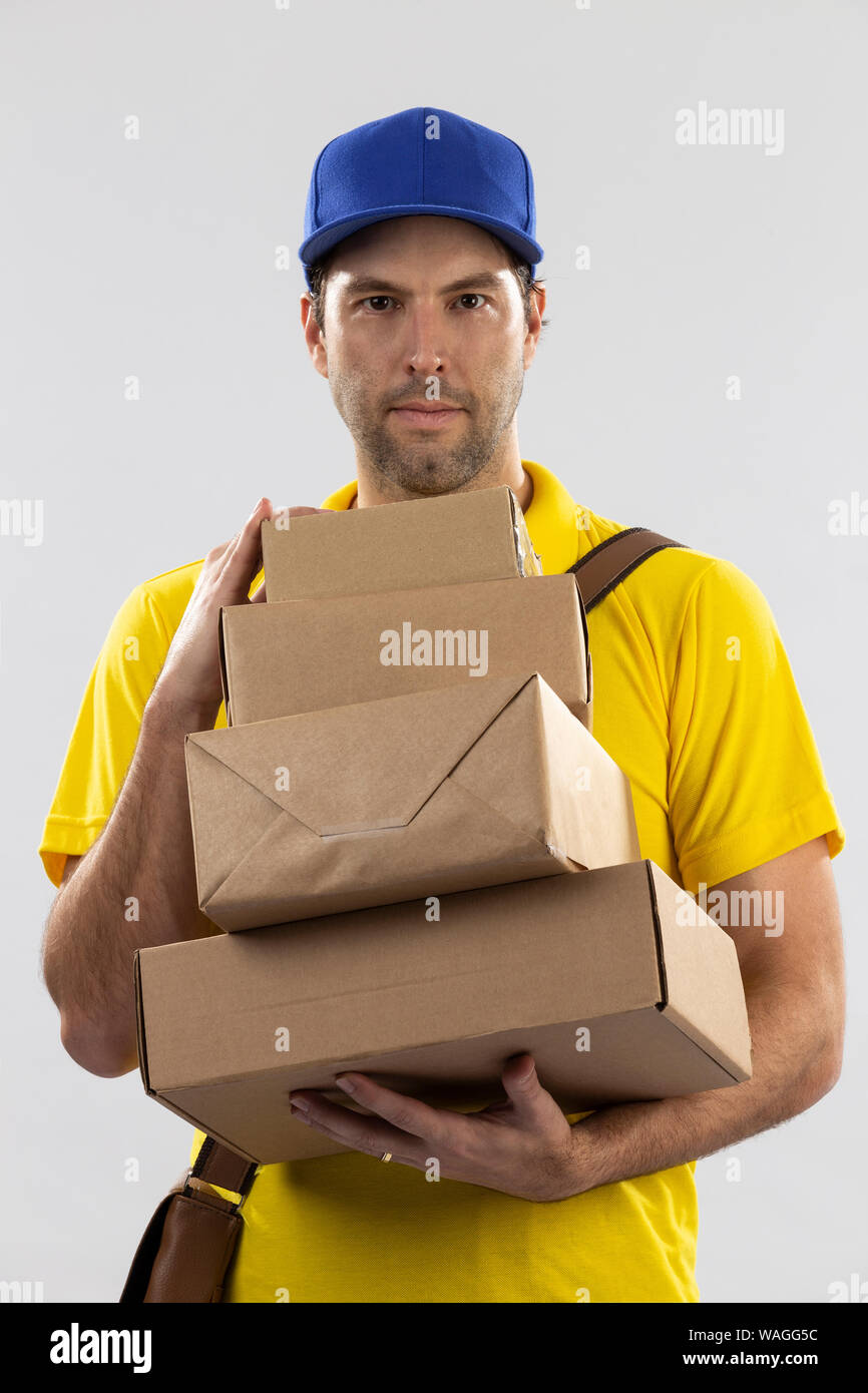 Brazilian mailman on a white background delivering a package. copy ...